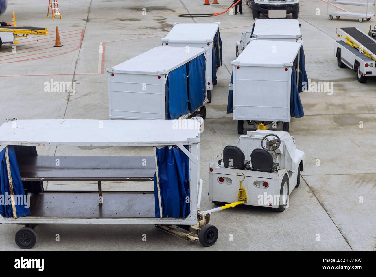 Luggage carrier vehicle airport hi-res stock photography and images - Alamy