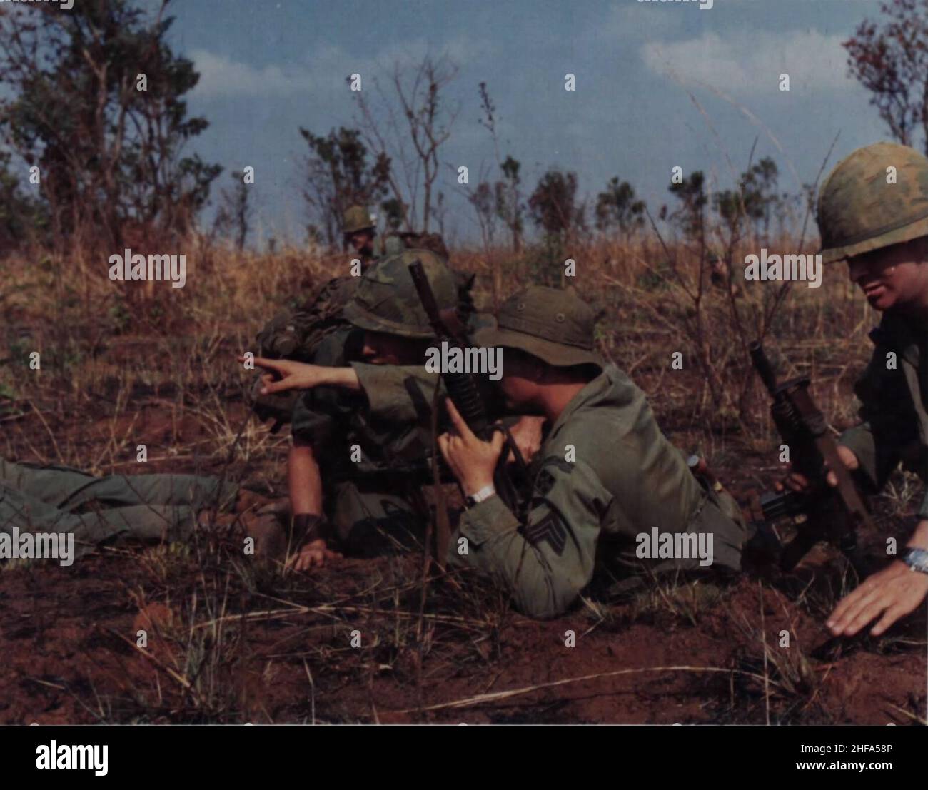 Scout dog tracker team commander briefs infantry platoon leader, 18 ...