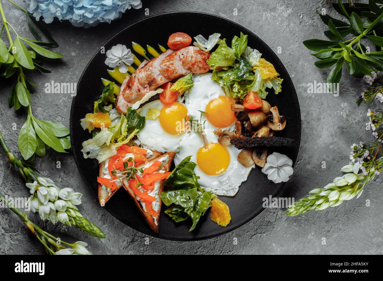 Full English breakfast with toast bread, chicken egg, mustard sauce ...