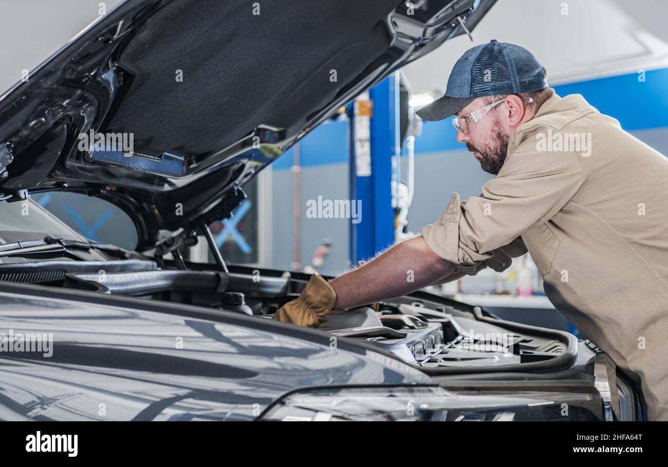 Vehicles Mechanic Performing Car Maintenance Inside Authorized ...