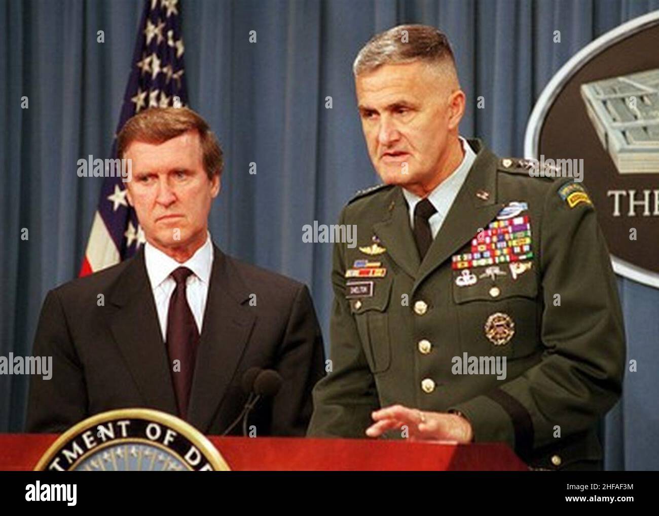 Secretary Cohen listens as Gen. Shelton briefs reporters in the ...