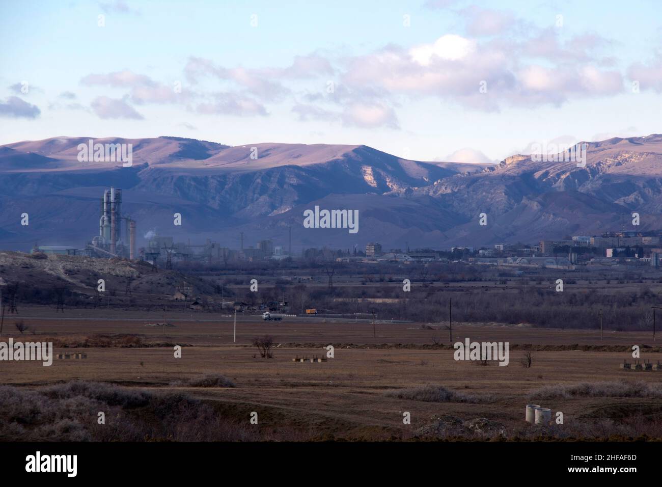 Mountain and town landscape during sunset in Kaspi, Georgia Stock Photo ...