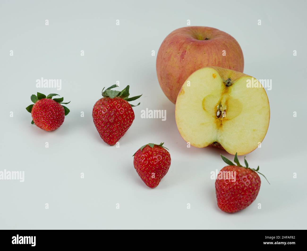 Strawberry and sliced apple on white background. healthy fruit concept ...