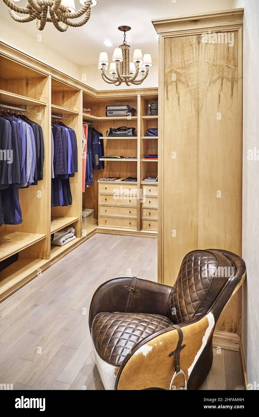 Stylish walk in closet with furniture of maple solid and veneer wood ...