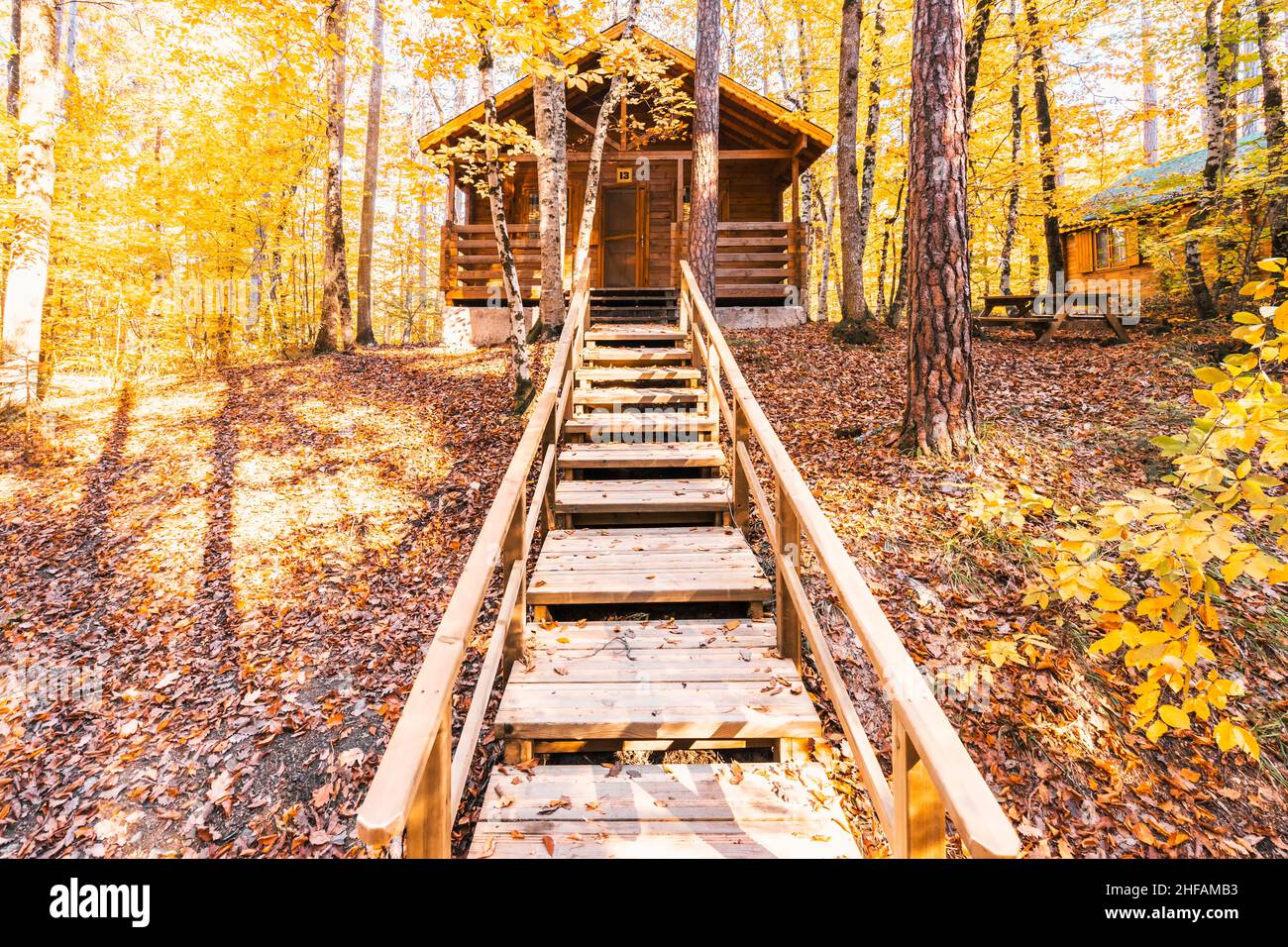 Beautiful autumn views with wooden house Stock Photo - Alamy