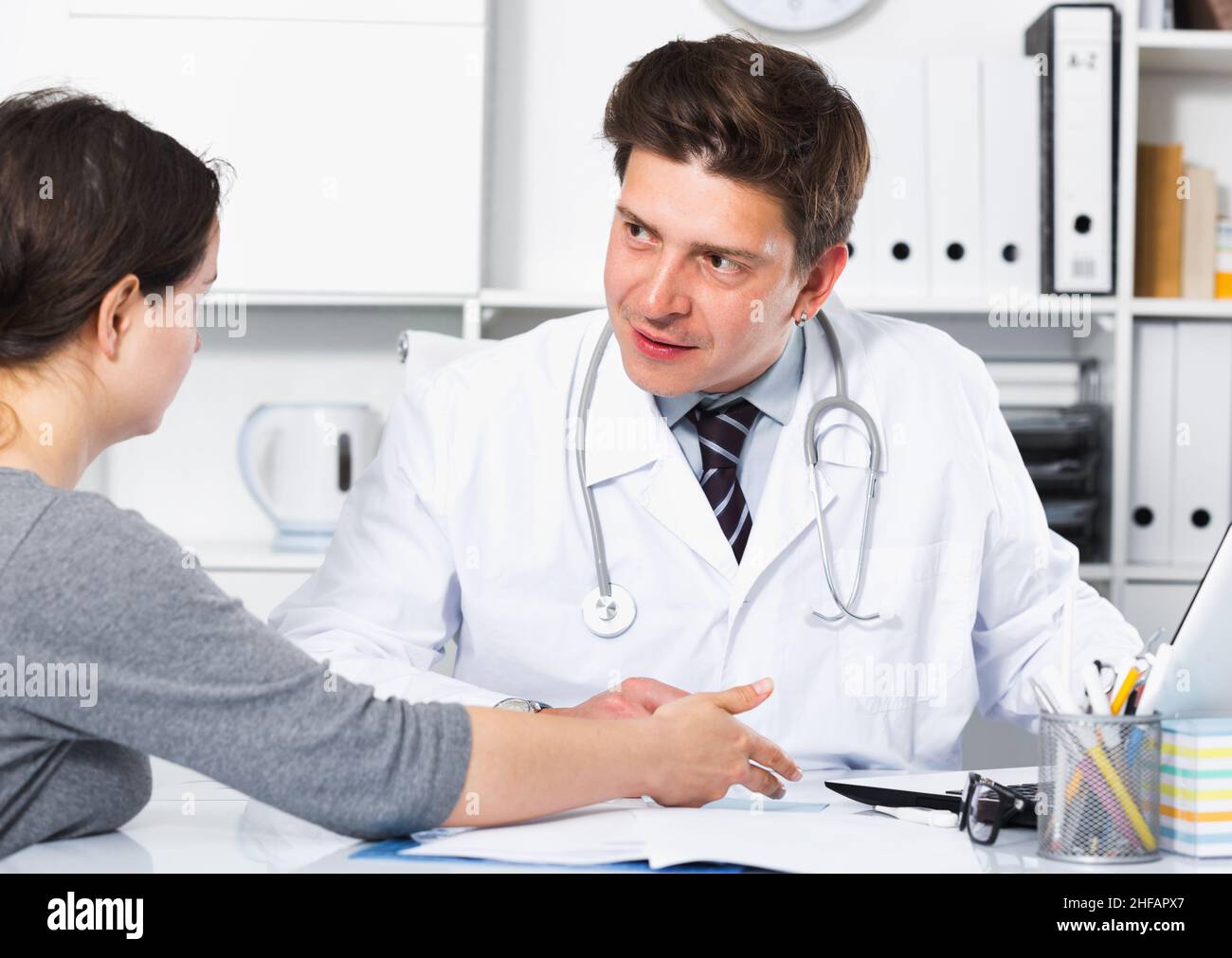 Medical doctor talking client using hi-res stock photography and images ...