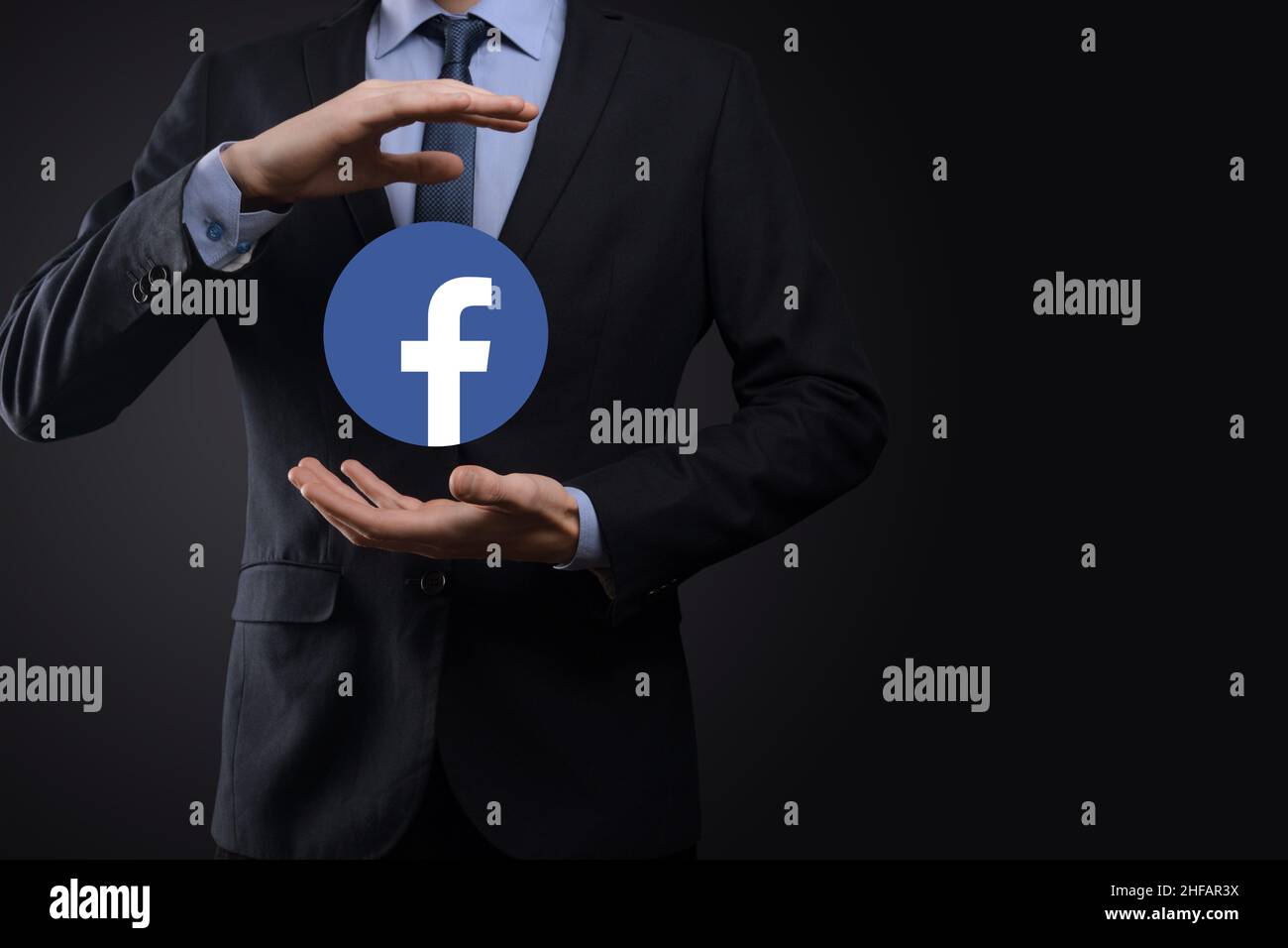 Onok,Ukraine - July 14,2021:Businessman holds, clicks, Facebook icon in ...