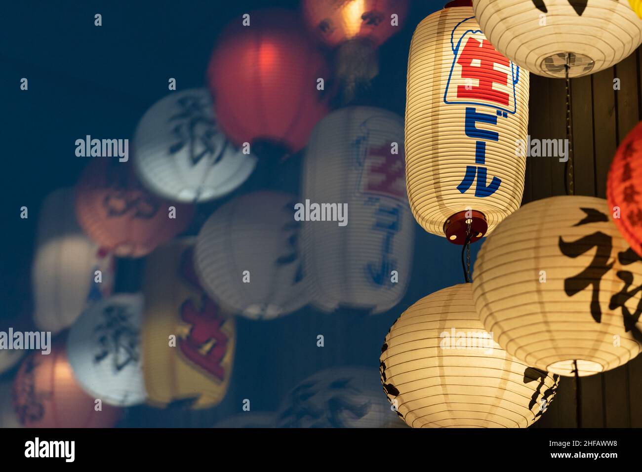 Bright chinese lanterns glowing inside stylish restaurant. Paper lamps ...