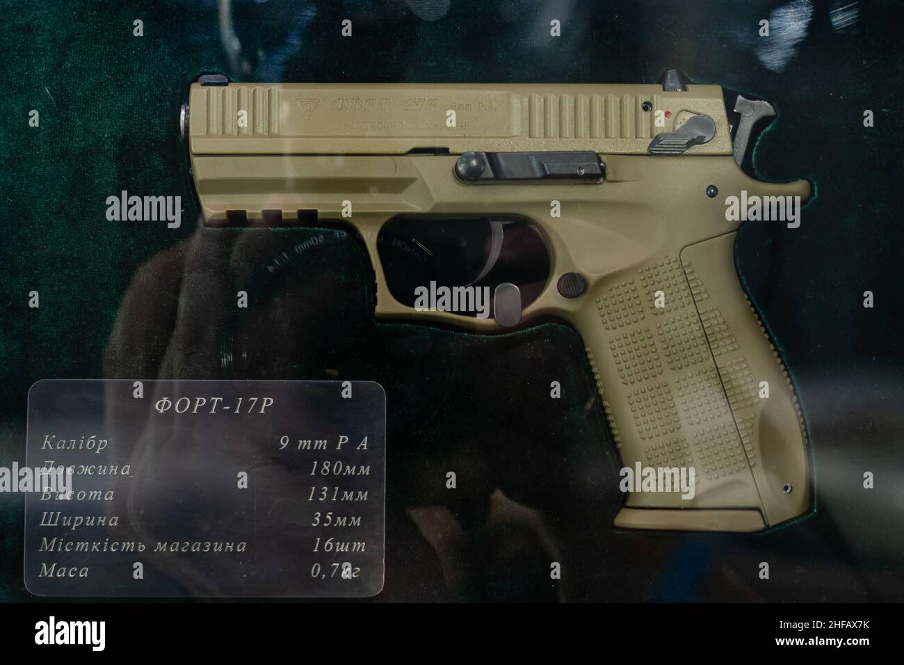 pistol behind protected glass. weapon Stock Photo - Alamy