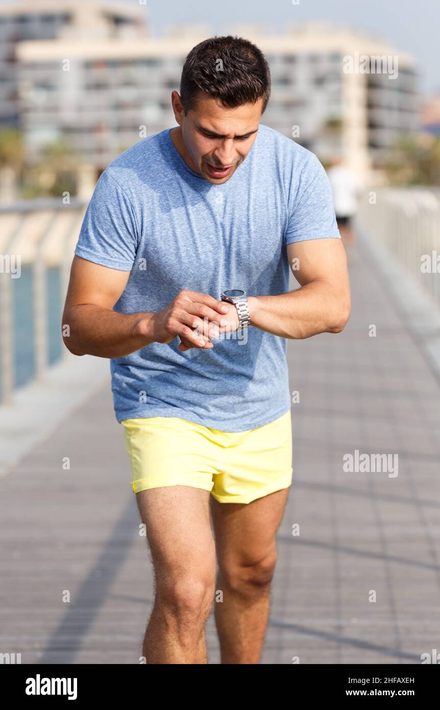 Man training with smartwatch Stock Photo - Alamy