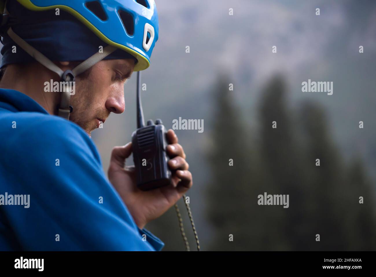A mountain rescuer, man with a walkie-talkie Stock Photo - Alamy