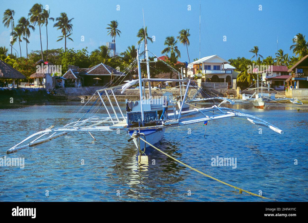 Traditional Filipino outrigger fishing boats - known as 'bangka' boats ...