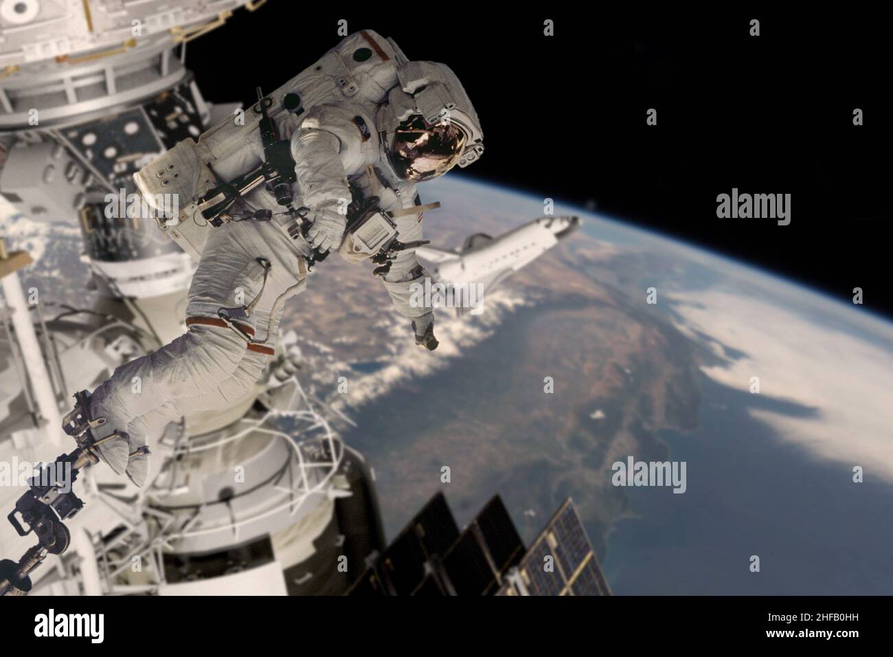 The astronaut in a space suit, in an outer space, is engaged in repair ...