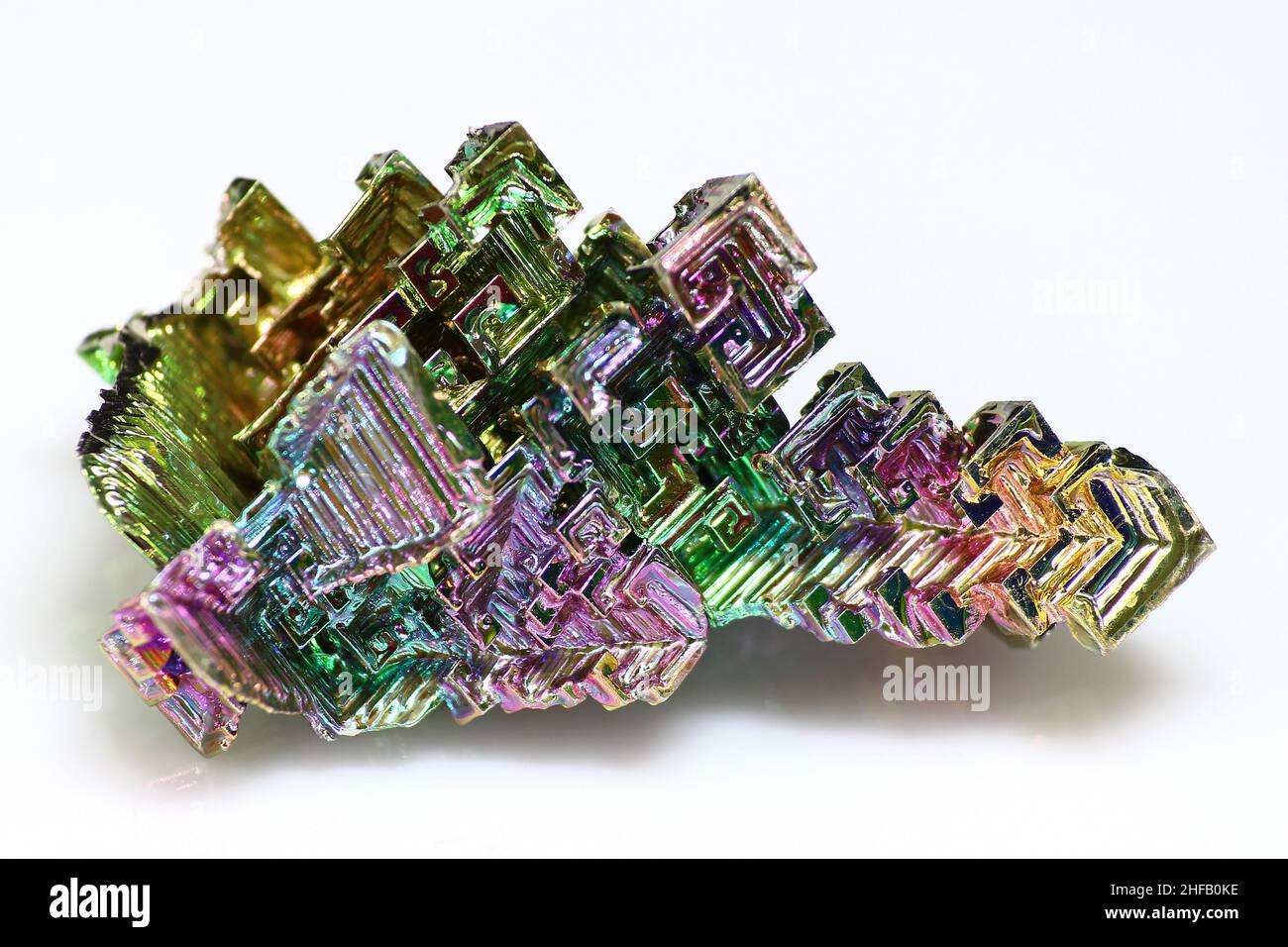 Synthetic bismuth Bismuthum crystal with iridescent oxide film on white ...