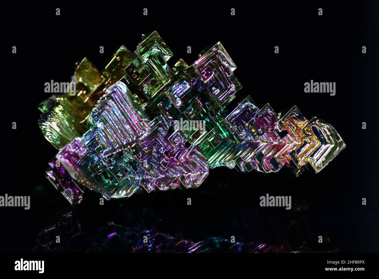 Synthetic bismuth Bismuthum crystal with iridescent oxide film on black ...