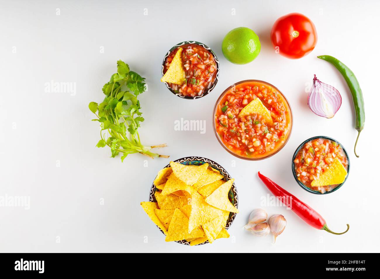 Traditional mexican salsa sauce with ingredients on white background ...