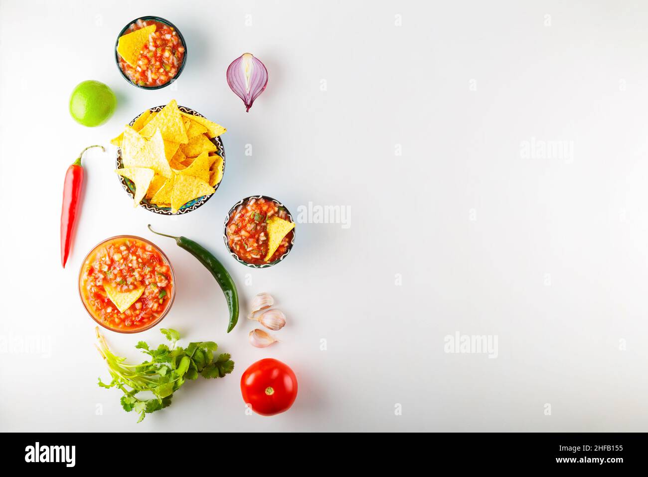 Traditional mexican salsa sauce with ingredients on white background ...