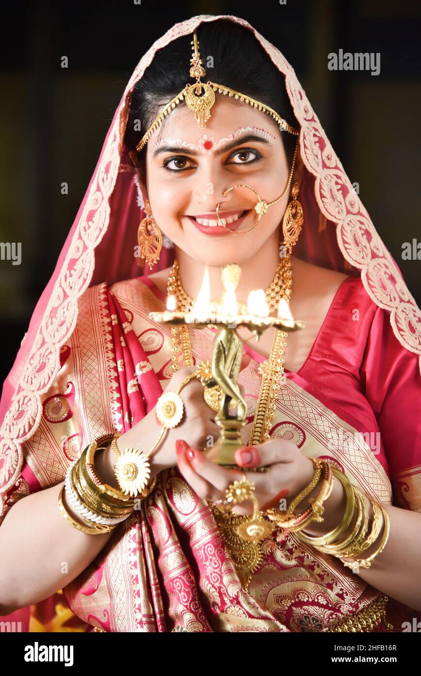 Portrait of a beautiful Indian Bengali woman dressed in ethnic saree and jewelry. India Stock ...