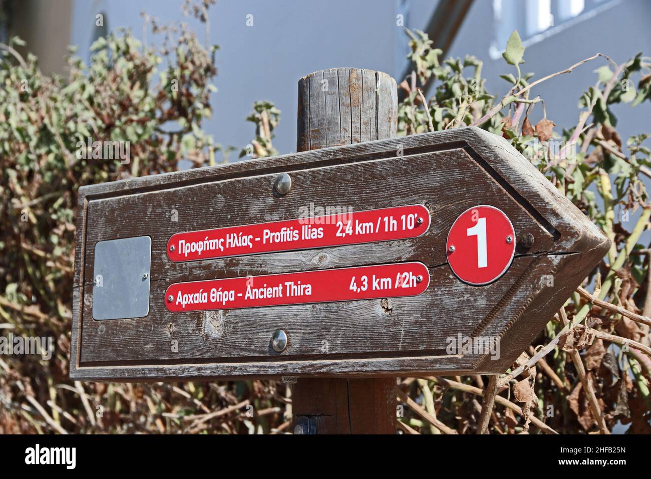 Wooden signpost showing walking route, Santorini Stock Photo - Alamy