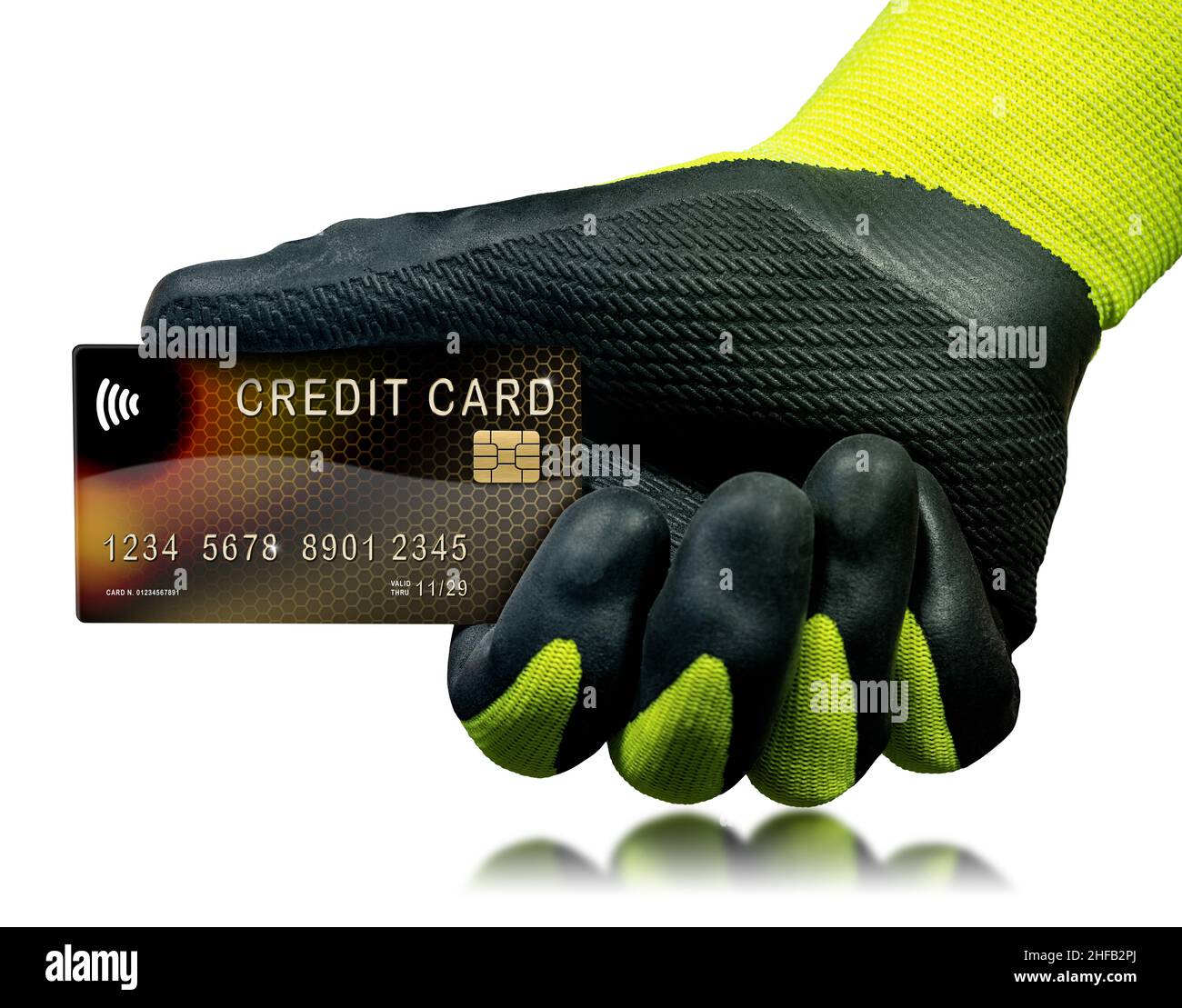 Manual worker with green and black protective work gloves holding a ...