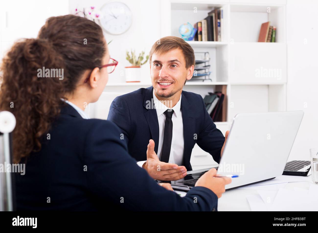 Man manager sitting and working on computer Stock Photo - Alamy