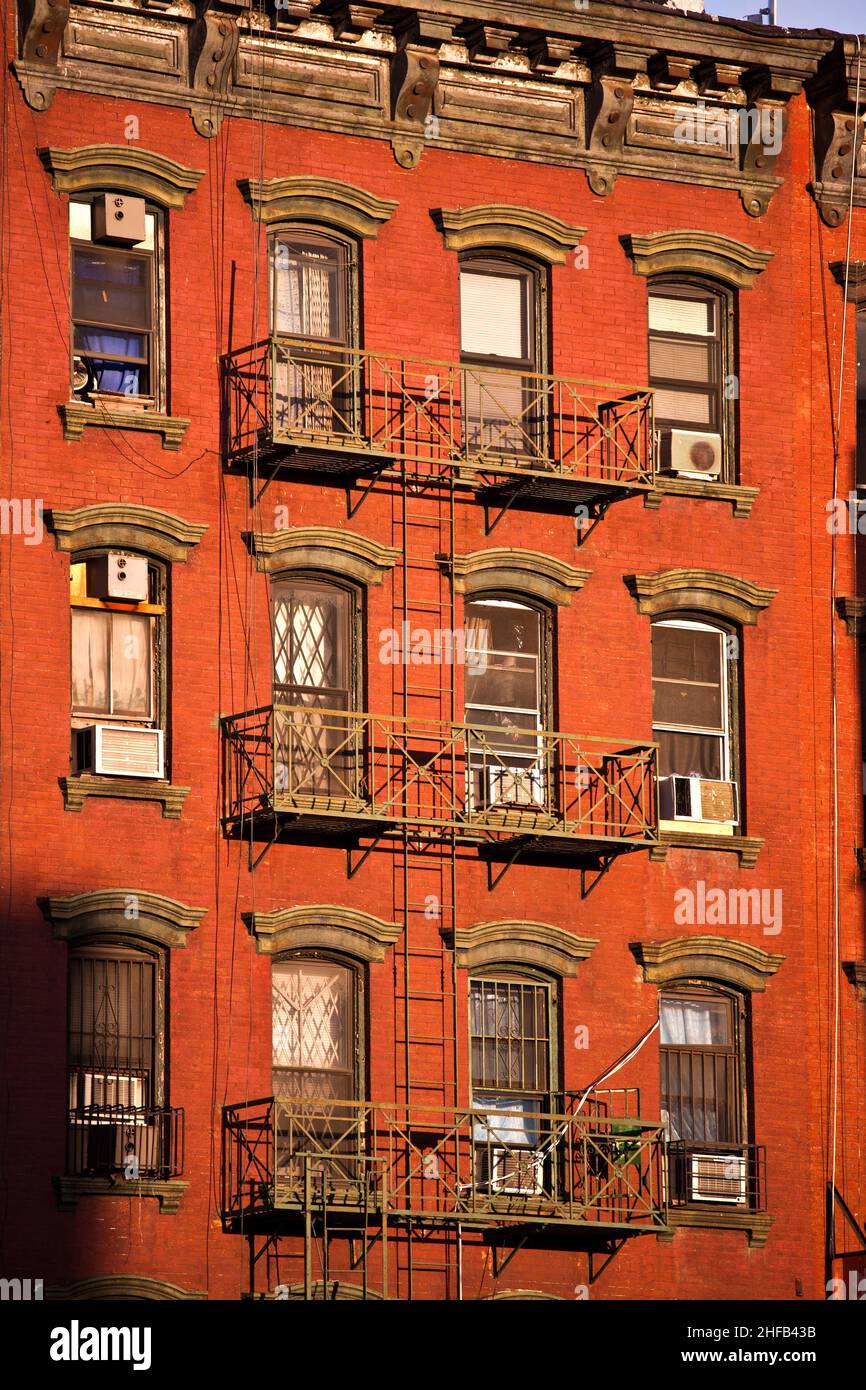 old iron fire escape rescue ladders at old houses in beautiful light ...