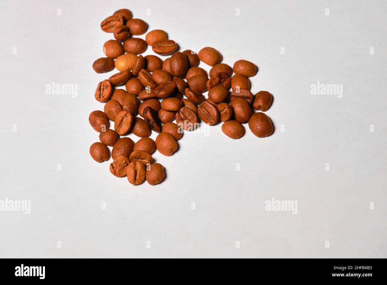 Beans of coffee, heart shape coffee arabica beans and white color ...
