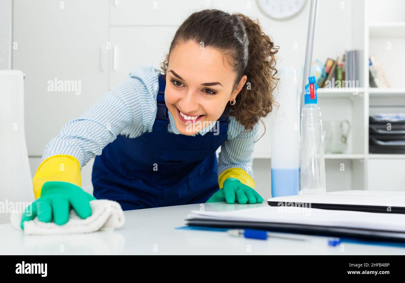 Female professional cleaner in office Stock Photo - Alamy