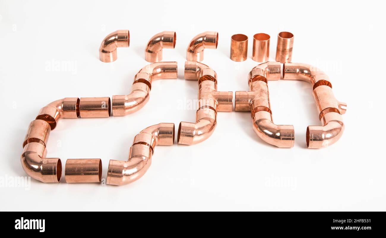 Group of fittings on a white background. Copper fittings for pipe ...