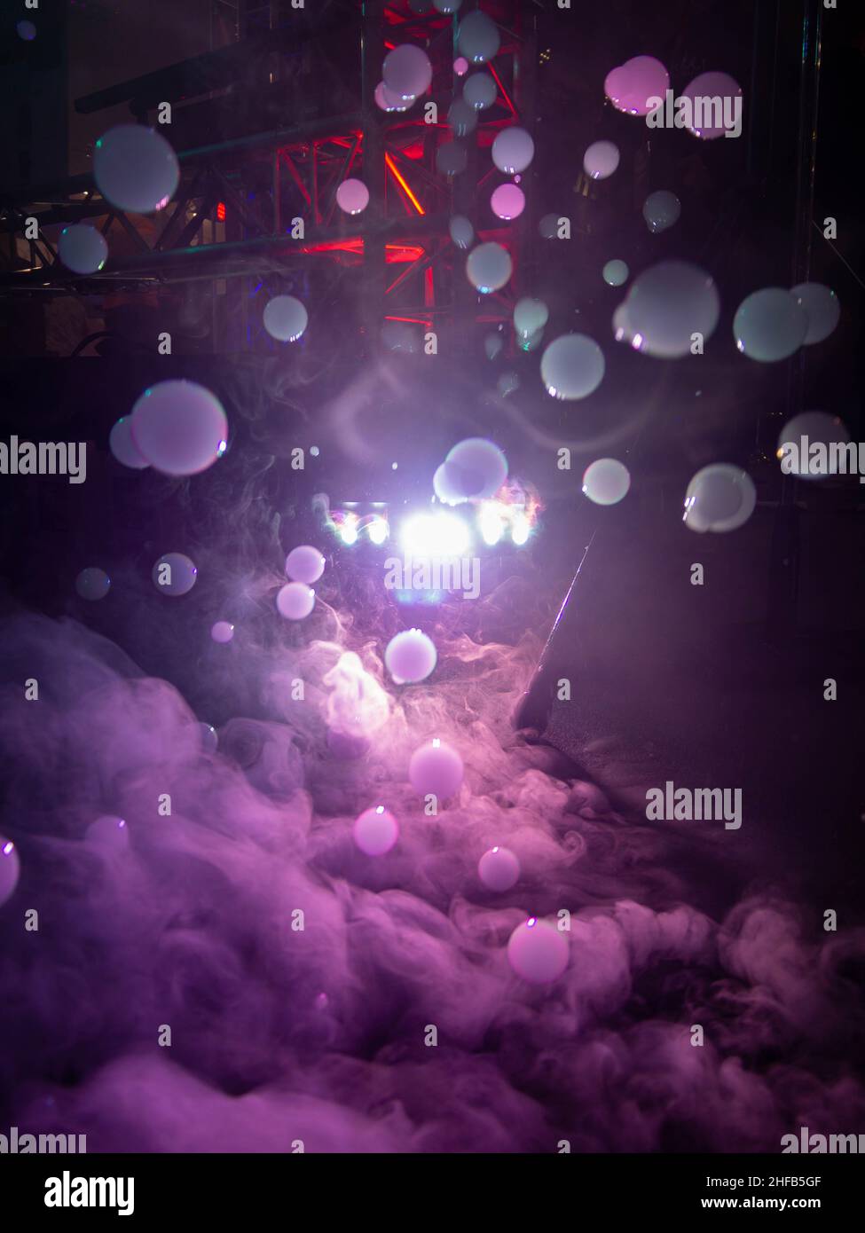 Smoke and smoke bubbles abstract effects with purple coloured lighting ...