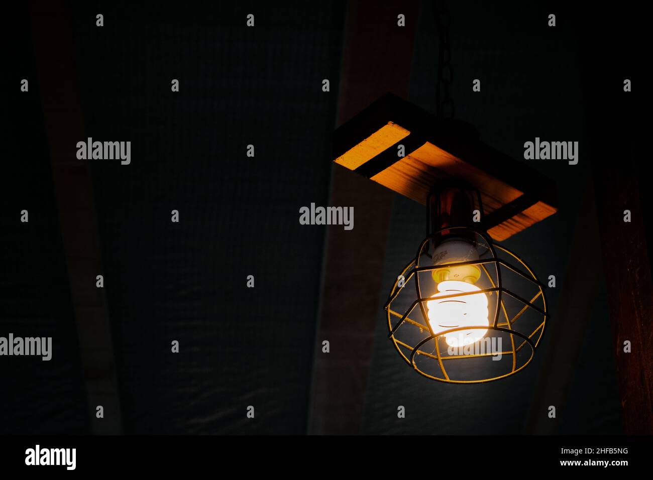 Vintage lamp, retro style lamp and light reflection on top of wood and ...