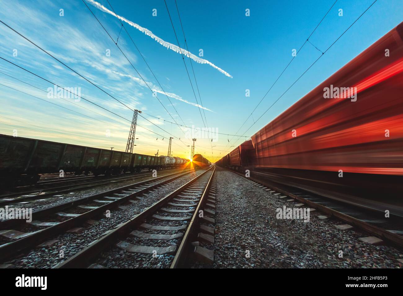 High-speed train moves by rail, delivery of goods by freight train ...