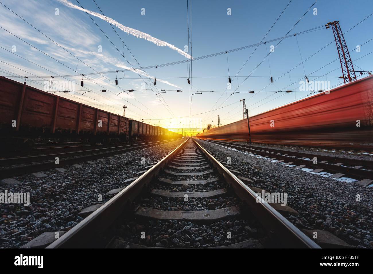 High-speed train moves by rail, delivery of goods by freight train ...