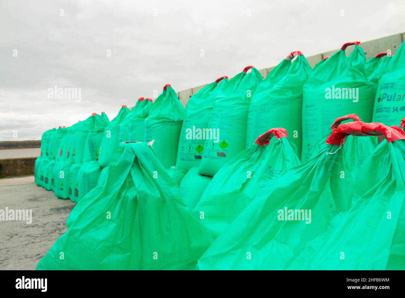 piles of green sacks of Pulan Ammonium Nitrate fertiliser known to ...