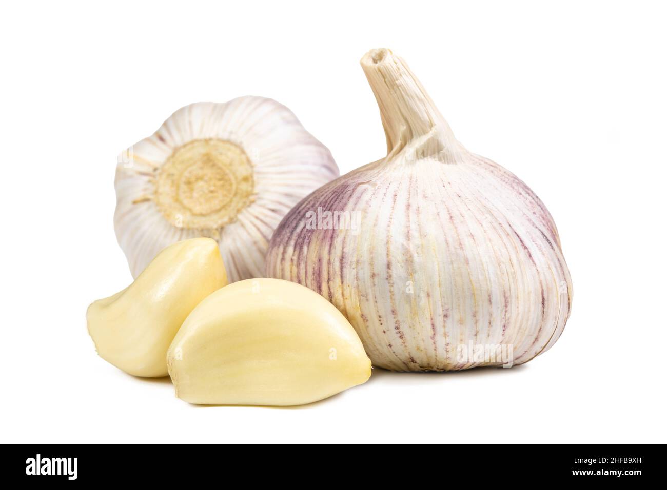Two garlic cloves and two garlic bulbs in a white background Stock ...