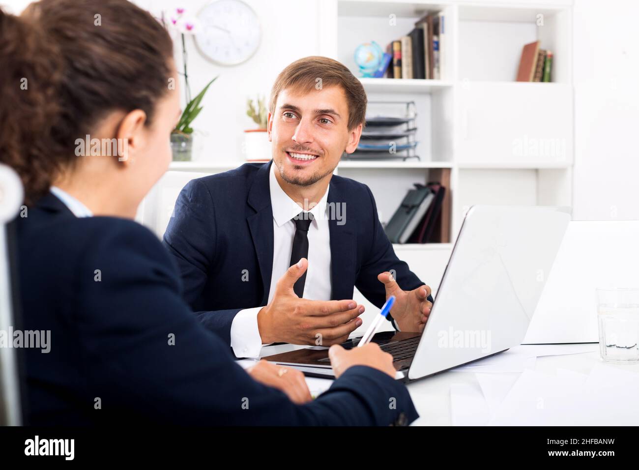 Man manager sitting and working on computer Stock Photo - Alamy
