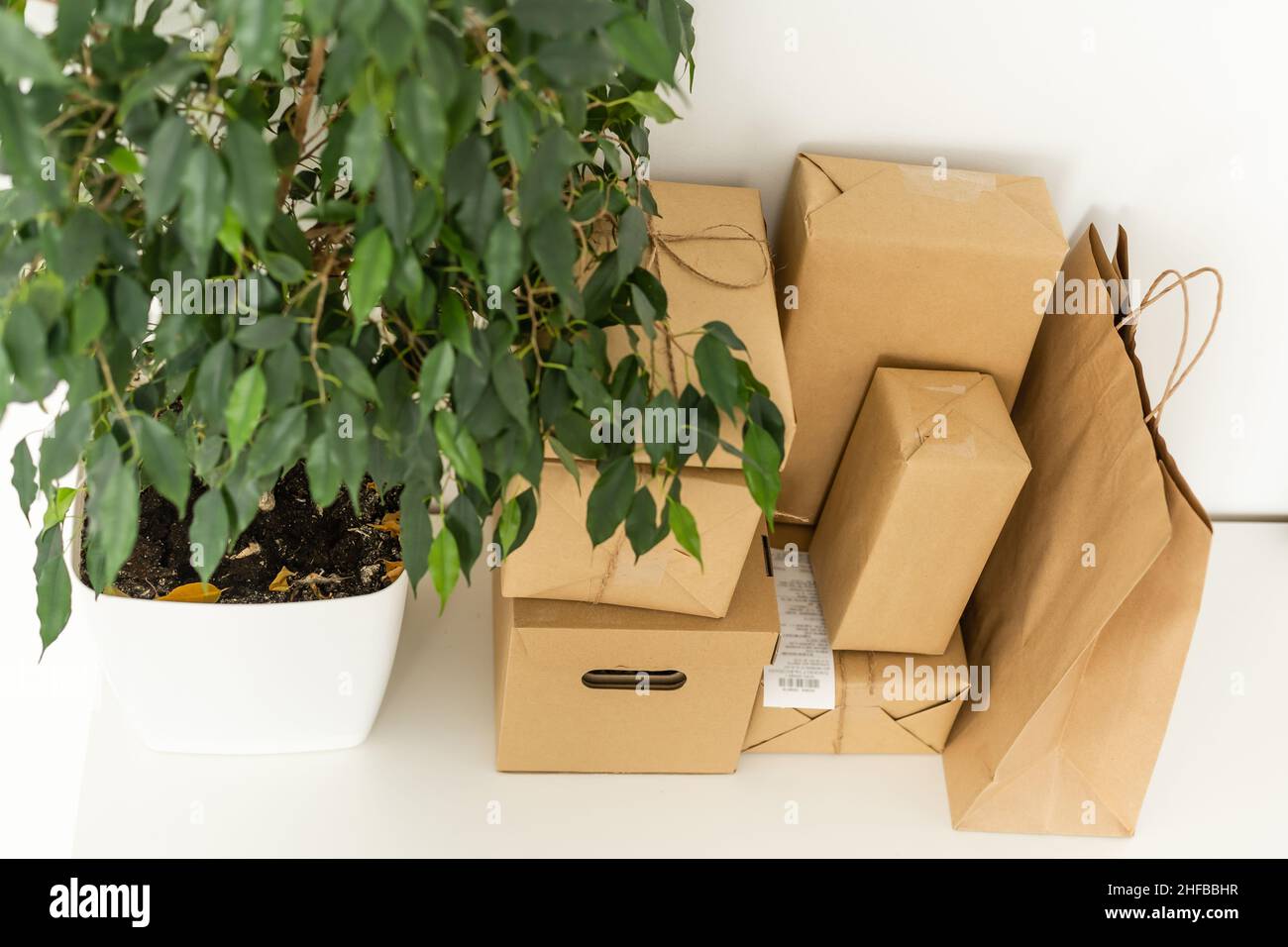 Pile of cardboard boxes isolated on white Stock Photo - Alamy