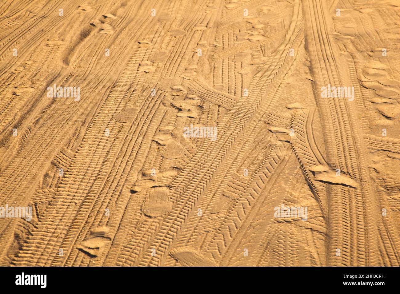 marks of tires in the fine sand Stock Photo - Alamy