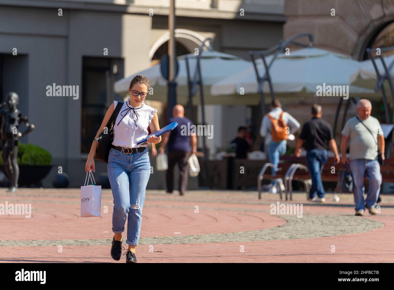 Timisoara, Romania - September 15, 2021: Woman walking on the street ...