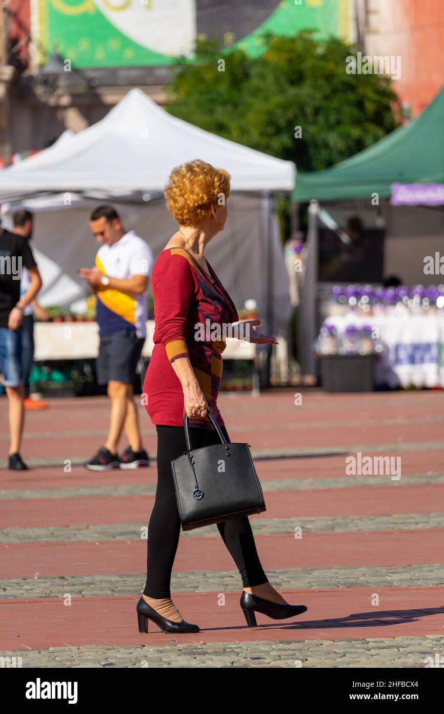 Timisoara, Romania - September 25, 2021: Woman walking on the street ...