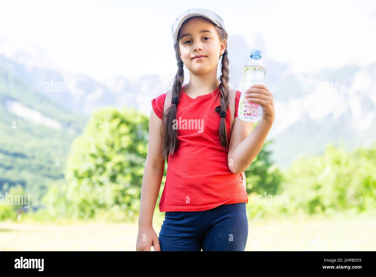 Portrait of a cute little girl in mountains Stock Photo - Alamy