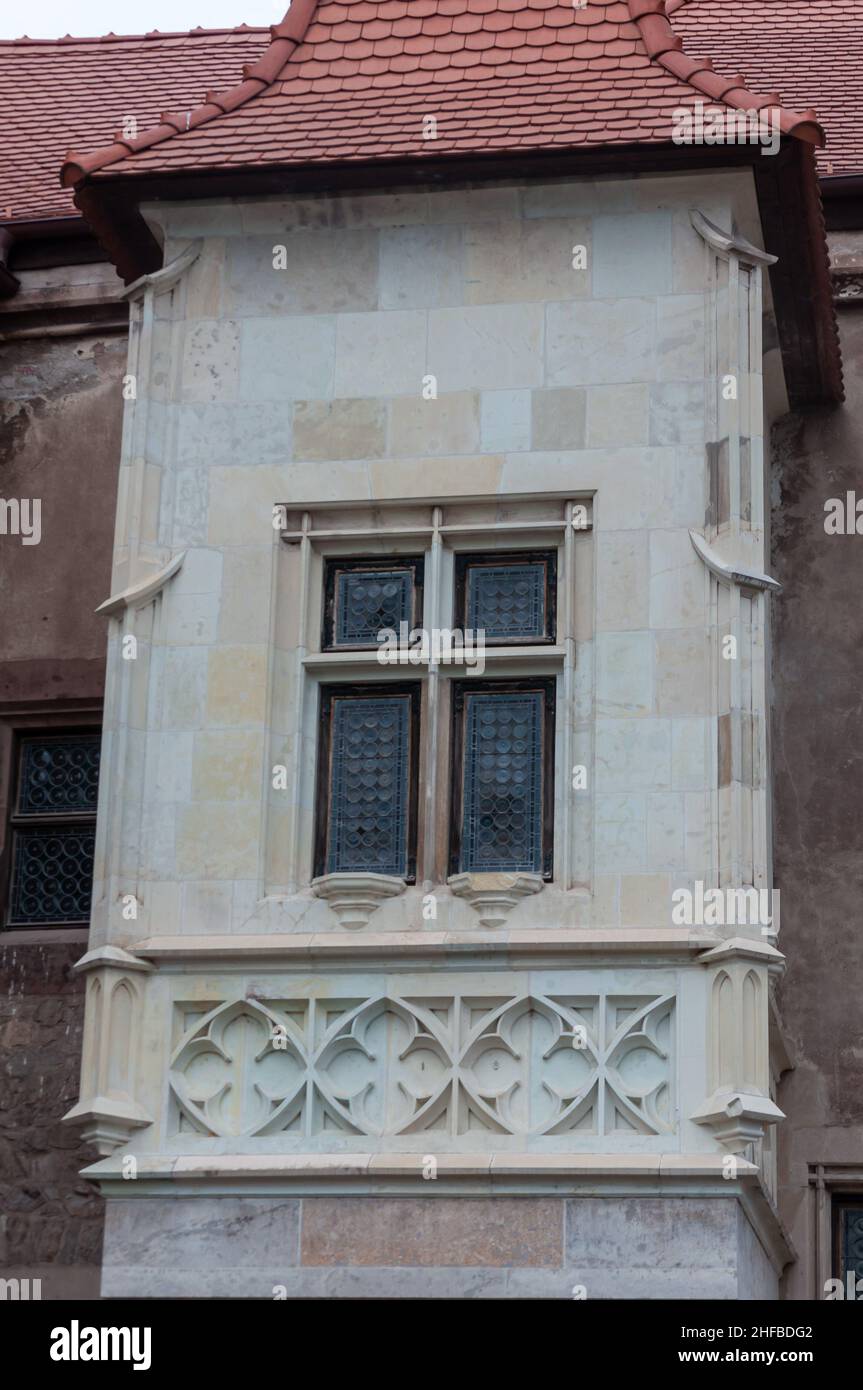 Beautiful design of a small window of a castle Stock Photo - Alamy