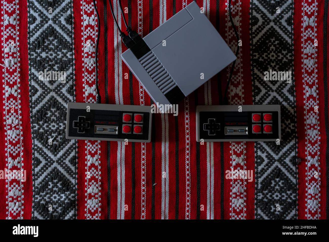 Retro gaming console with classic gamepad controller on a table Stock ...