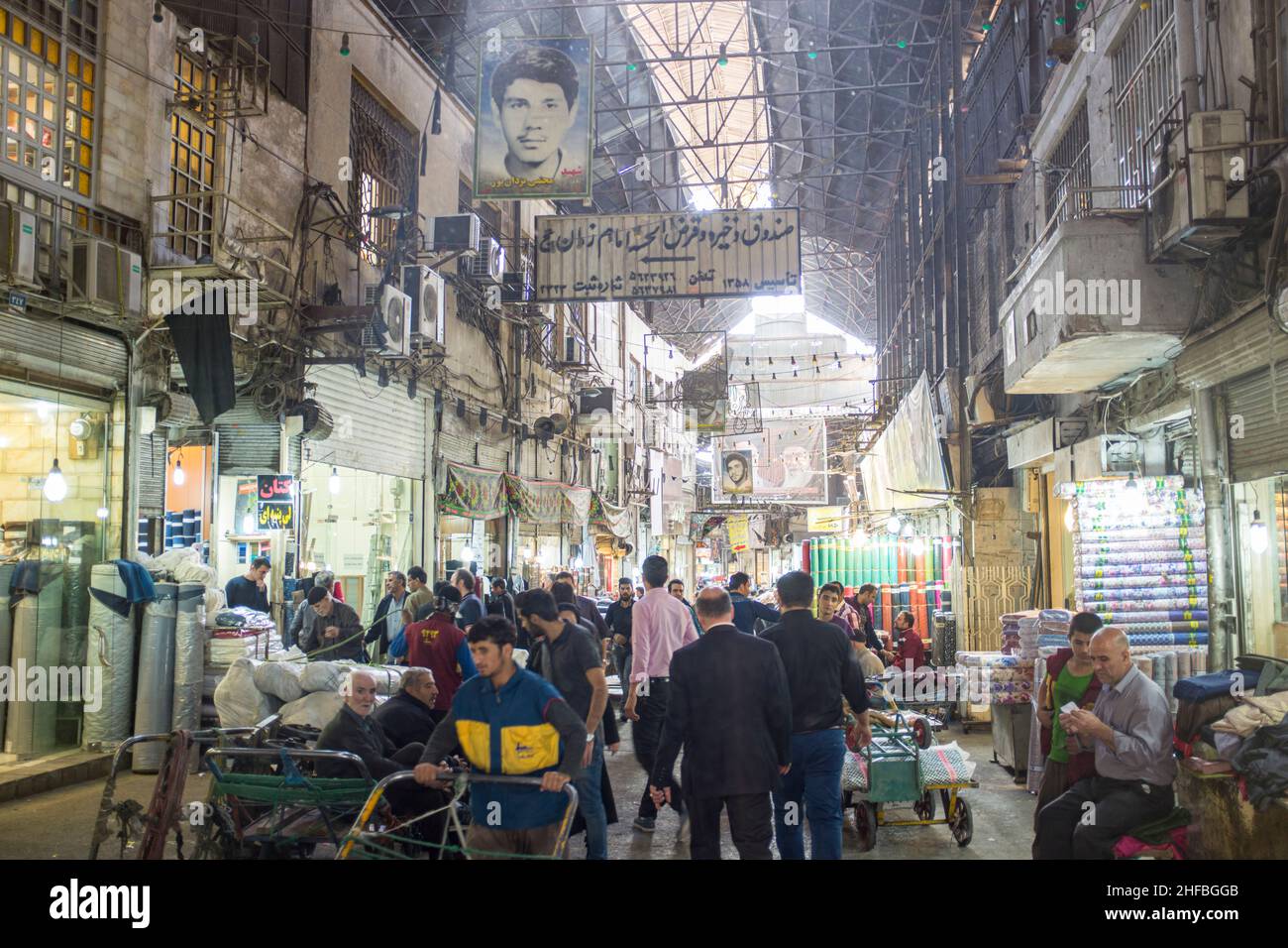 Shoppers and traders walking past market stalls through a busy Grand ...