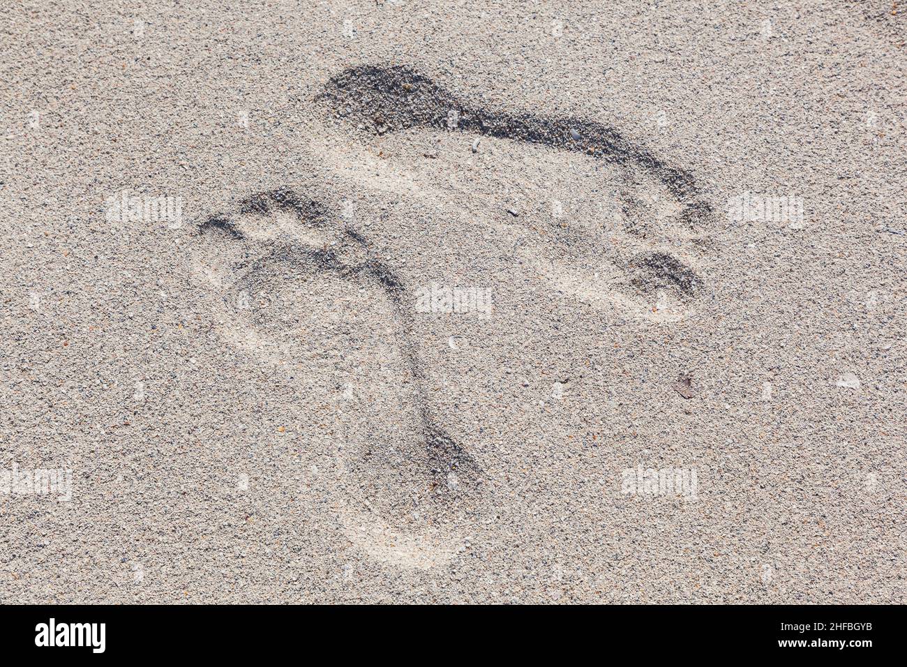 footprints of man at the beach in vice versa direction Stock Photo - Alamy