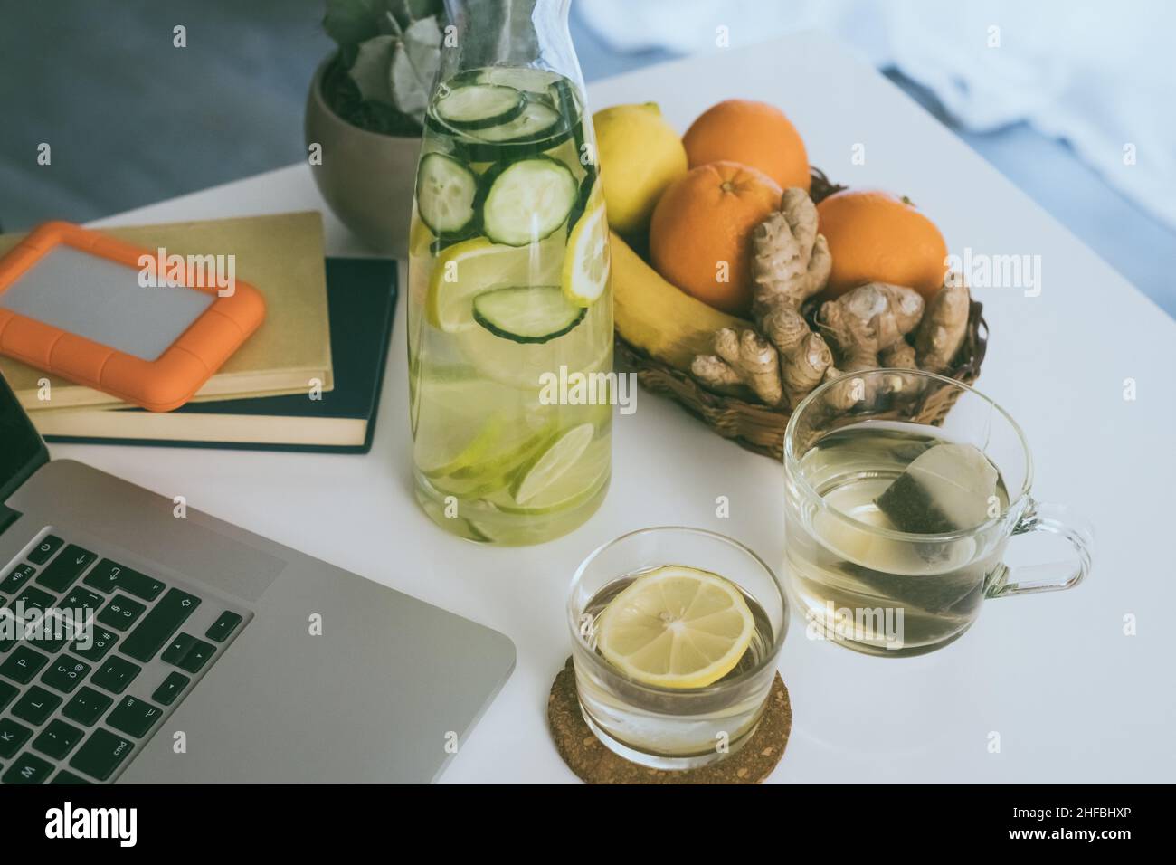 Morning time at home healthy breakfast laptop and drink on table ...