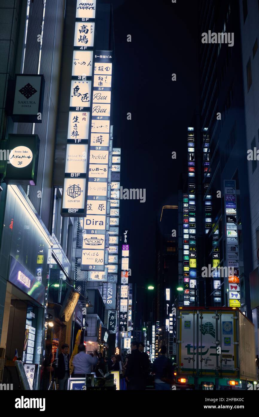 Tokyo, Japan - October 24, 2019: The night lights of Ginza. Logos ...