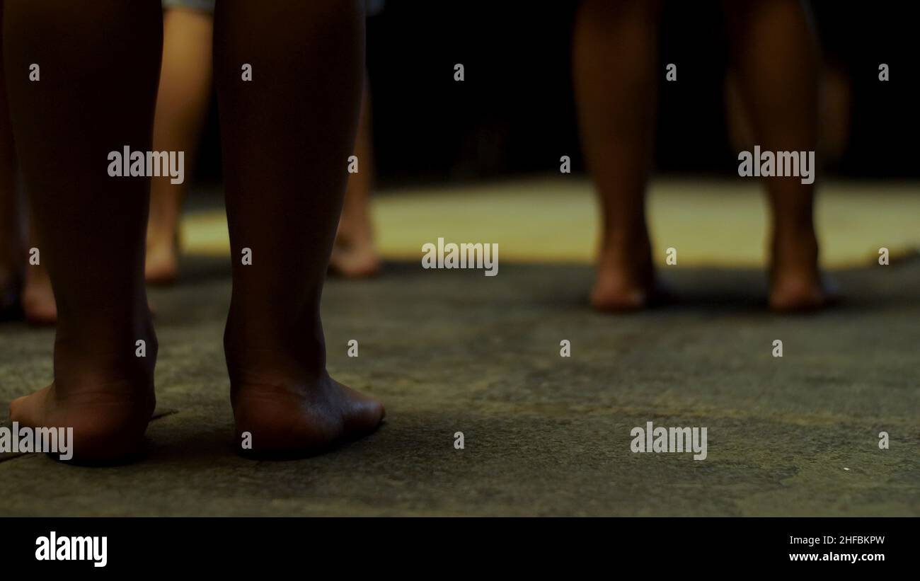 Closeup of black African people staying in dark room. Close up view of ...