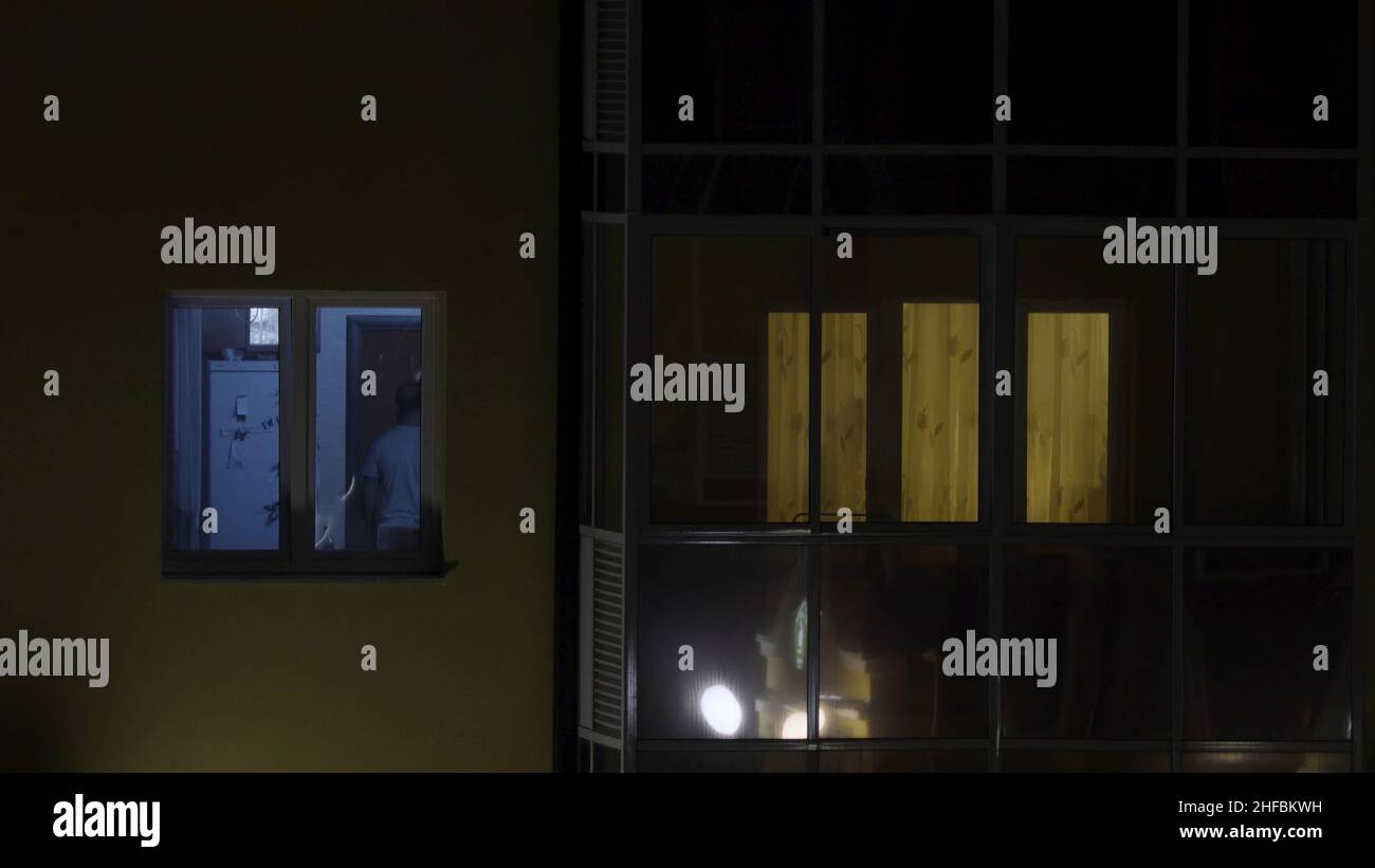 View on window of an apartment building outside at night. Wall with ...