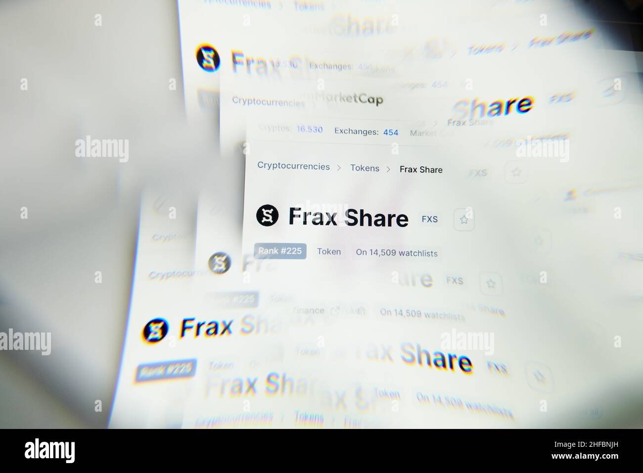 Milan, Italy - January 11, 2022: frax share - FXS logo on laptop screen seen through an optical ...